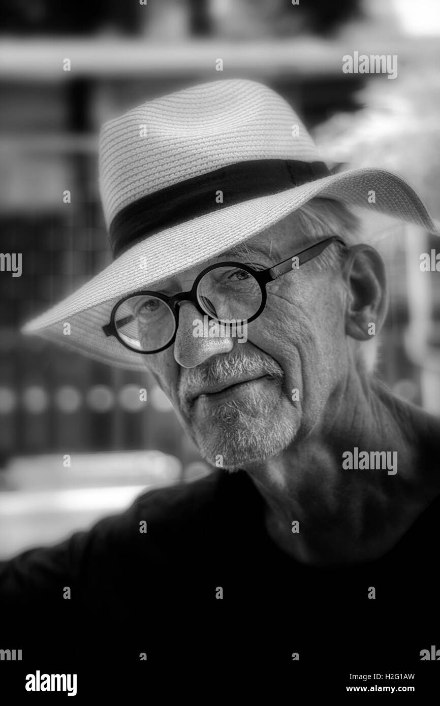 Black and white portrait. Senior male wearing a Panama hat. Black and ...