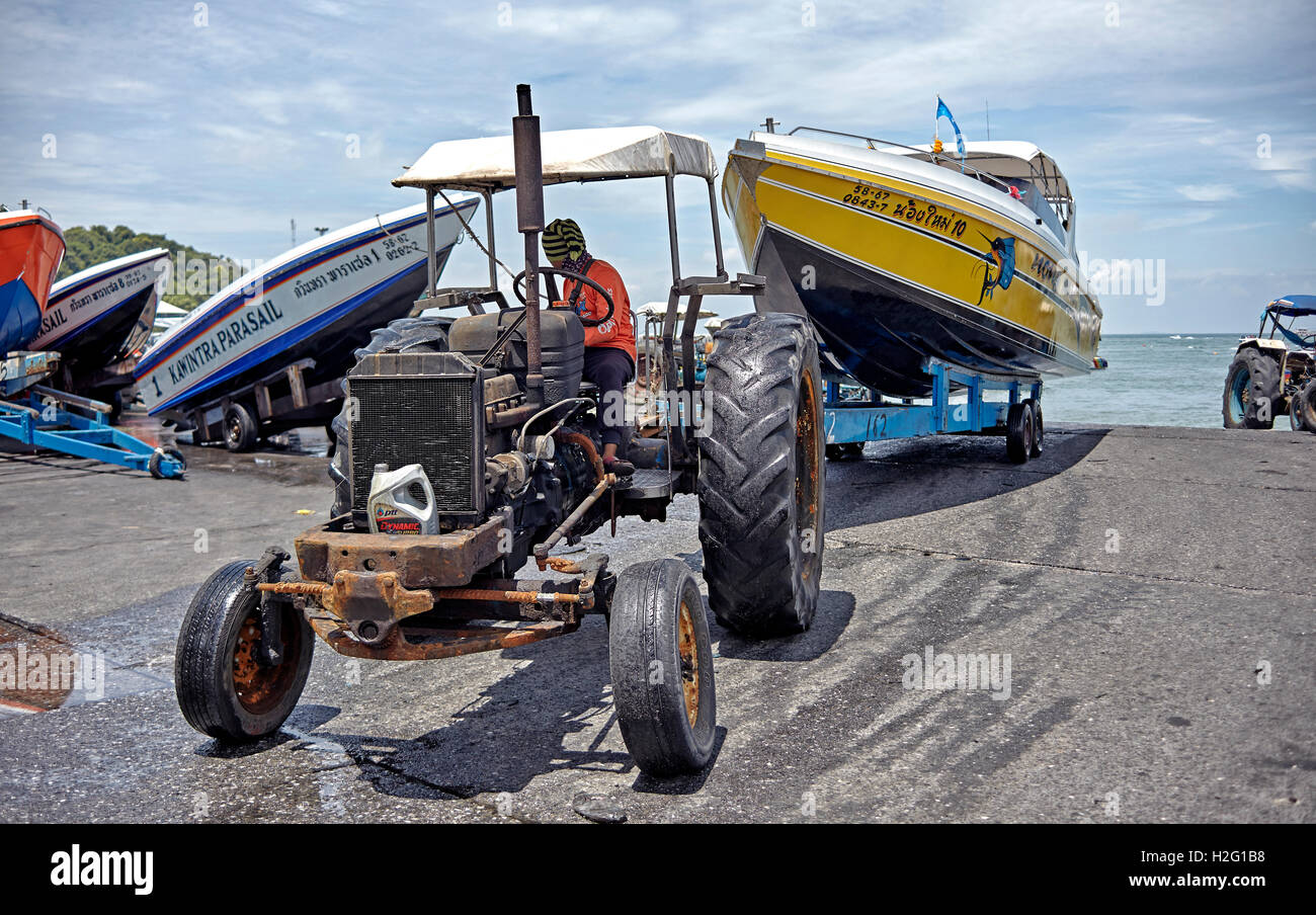 Tractor transporting boat sea hi-res stock photography and images - Alamy