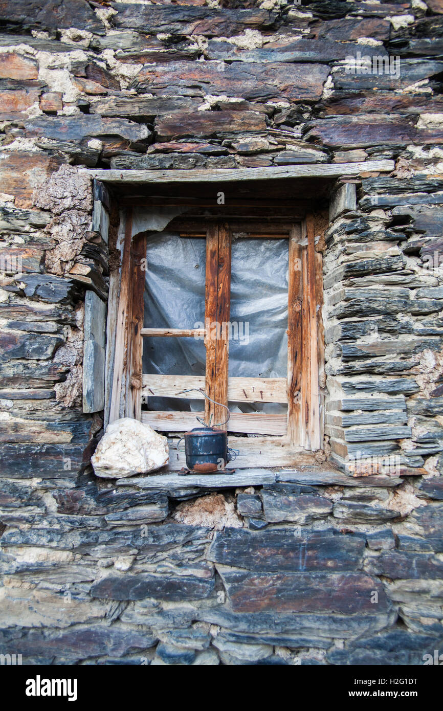 Color image of a broken window on a stone wall Stock Photo - Alamy