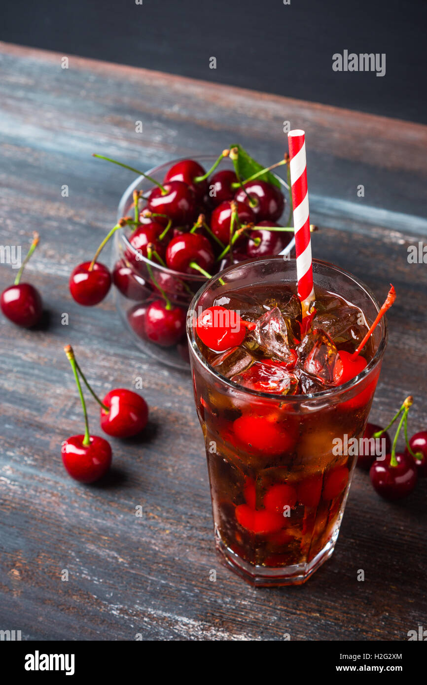 Refreshing cold cherry cola on the wooden background Stock Photo - Alamy