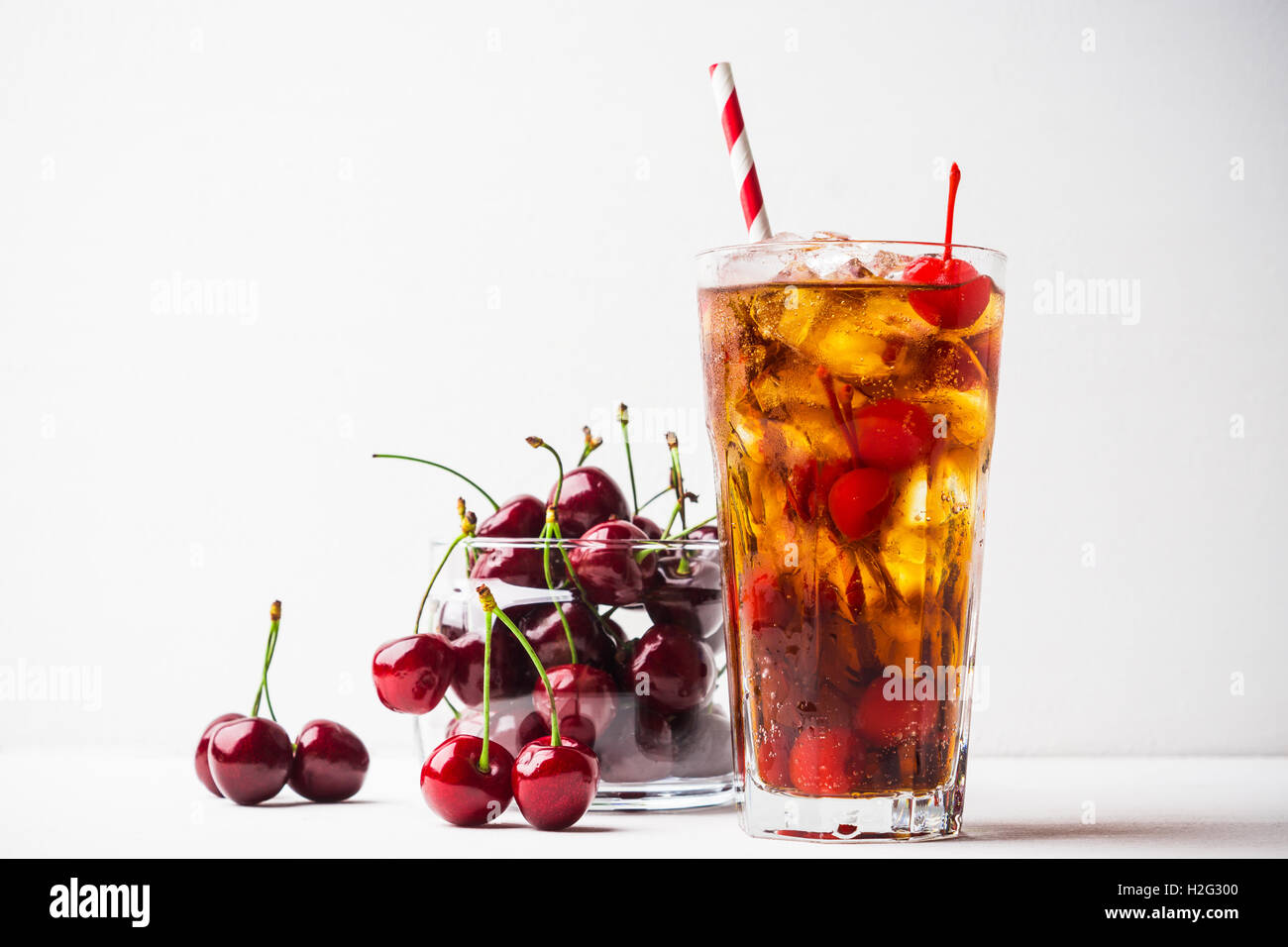 Refreshing cold cherry cola on the wooden background Stock Photo - Alamy