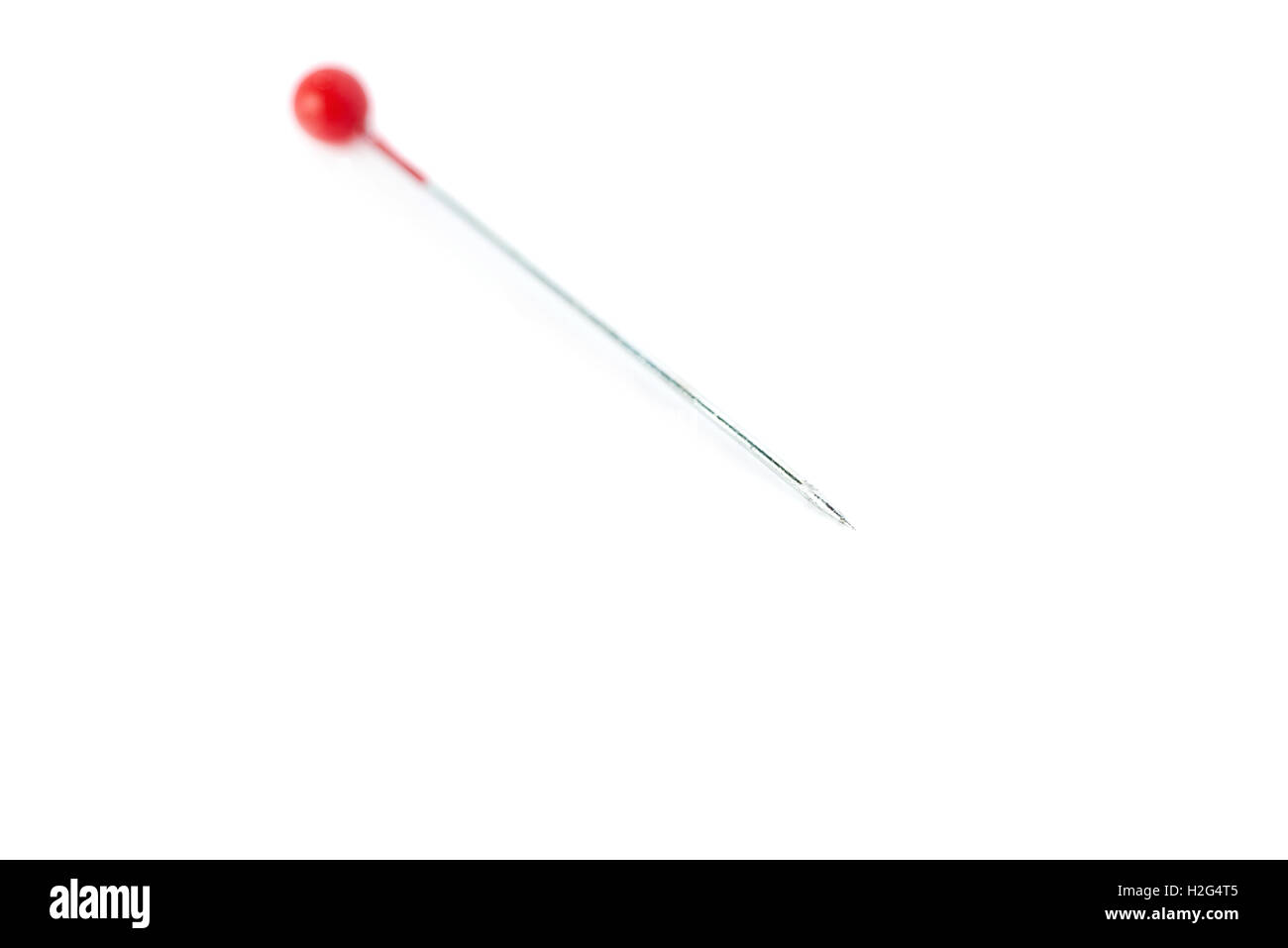 Small needle isolated over the white background Stock Photo - Alamy