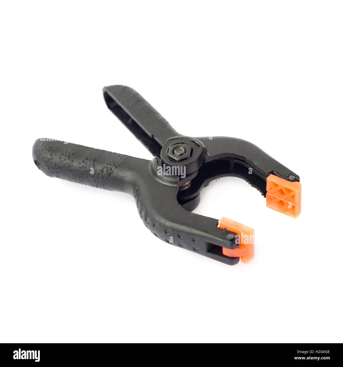 Clamp with orange plastic jaws, isolated over the white background ...