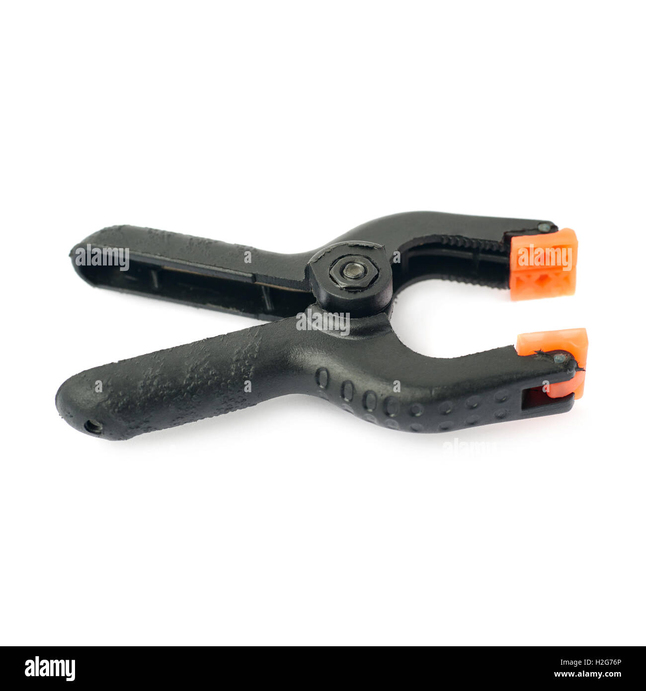 Clamp with orange plastic jaws, isolated over the white background ...