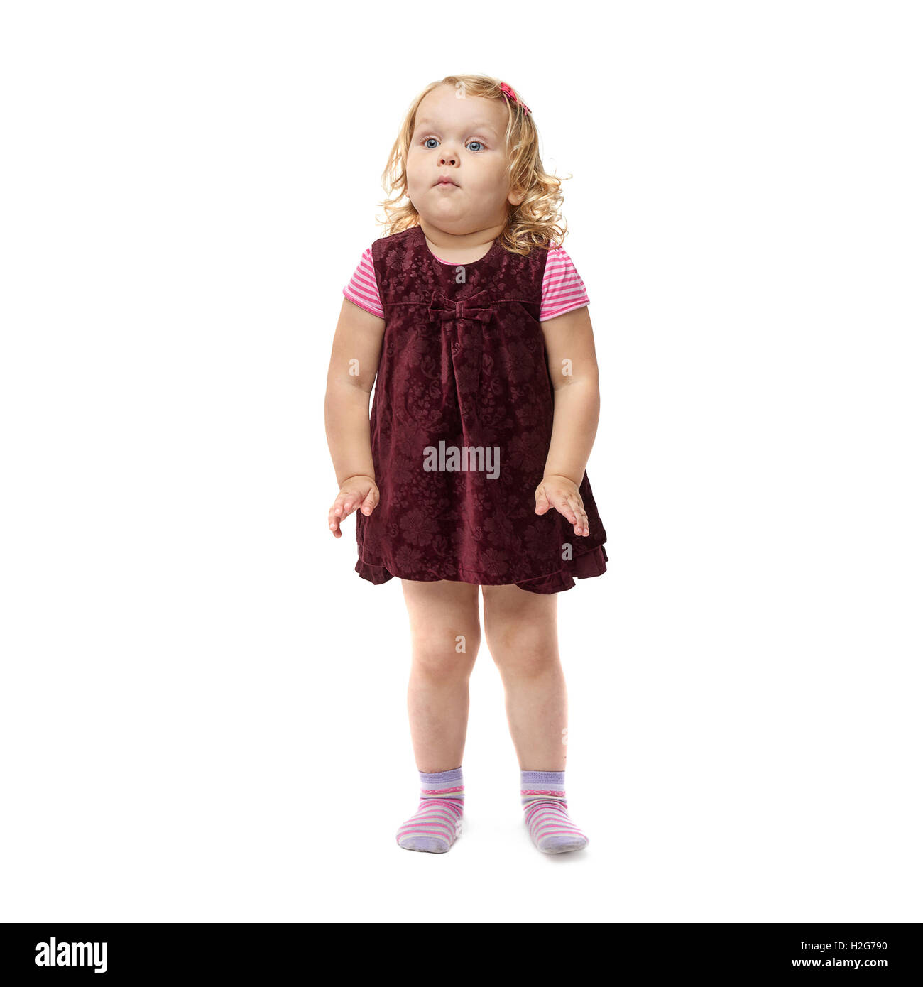 Young little girl standing over isolated white background Stock Photo ...