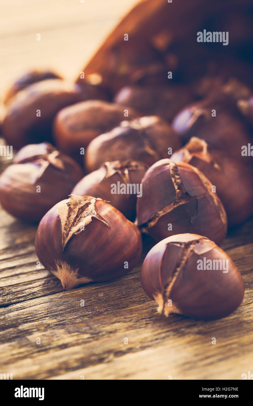 Delicious roasted chestnuts ready to eat on rustic wooden board Stock ...
