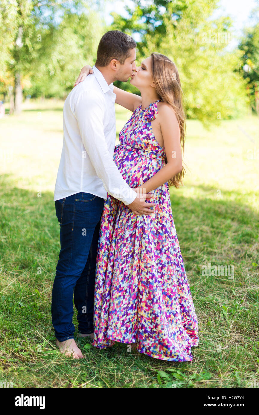 Beautiful pregnant couple happy together expecting a child. Man and ...