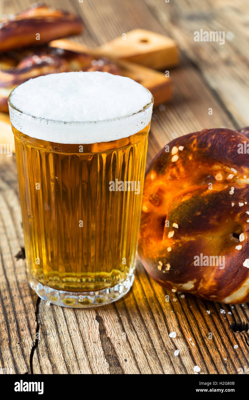 Refreshing beer ready to drink and fresh bavarian pretzels. Traditional ...