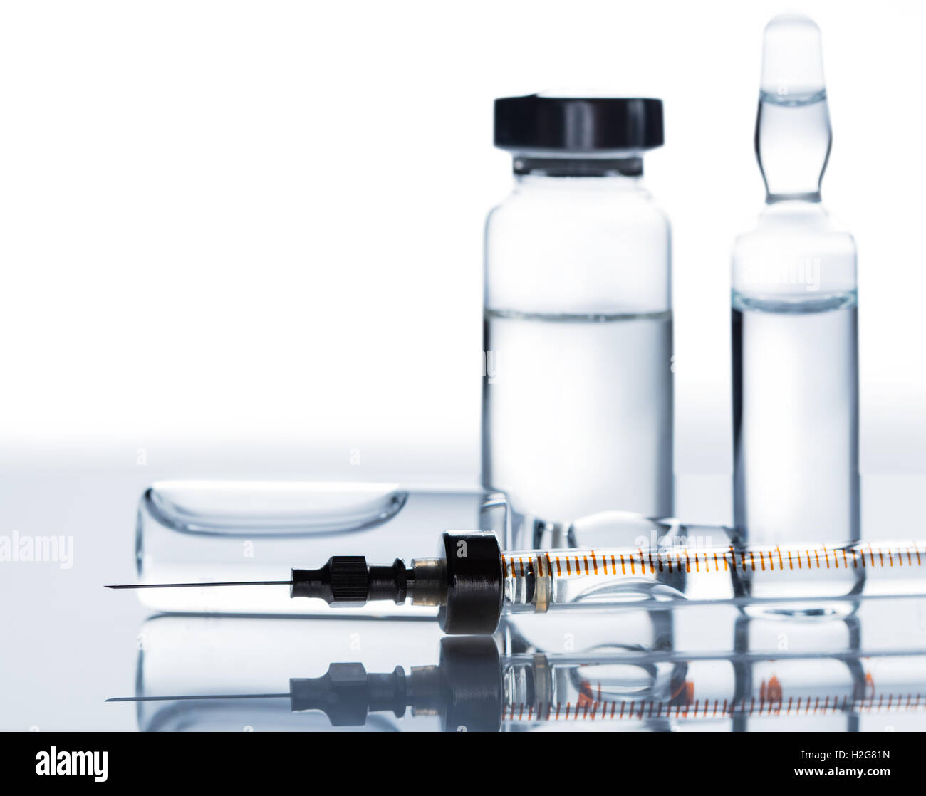 medicament in a glass vial and syringe closeup Stock Photo - Alamy