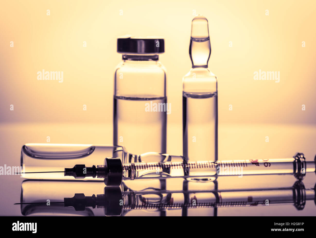 medicament in a glass vial and syringe closeup Stock Photo - Alamy