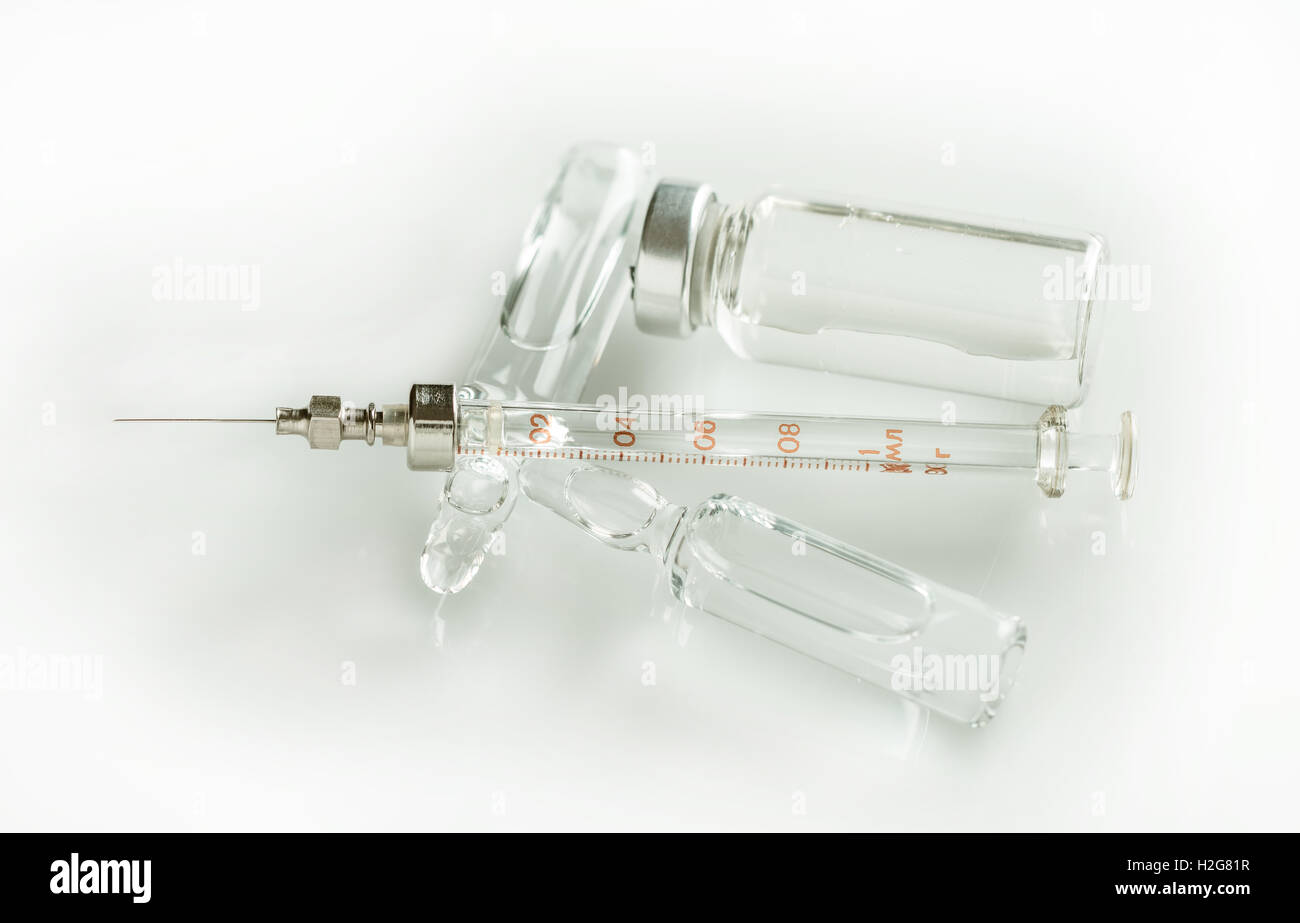 medicament in a glass vial and syringe closeup Stock Photo - Alamy