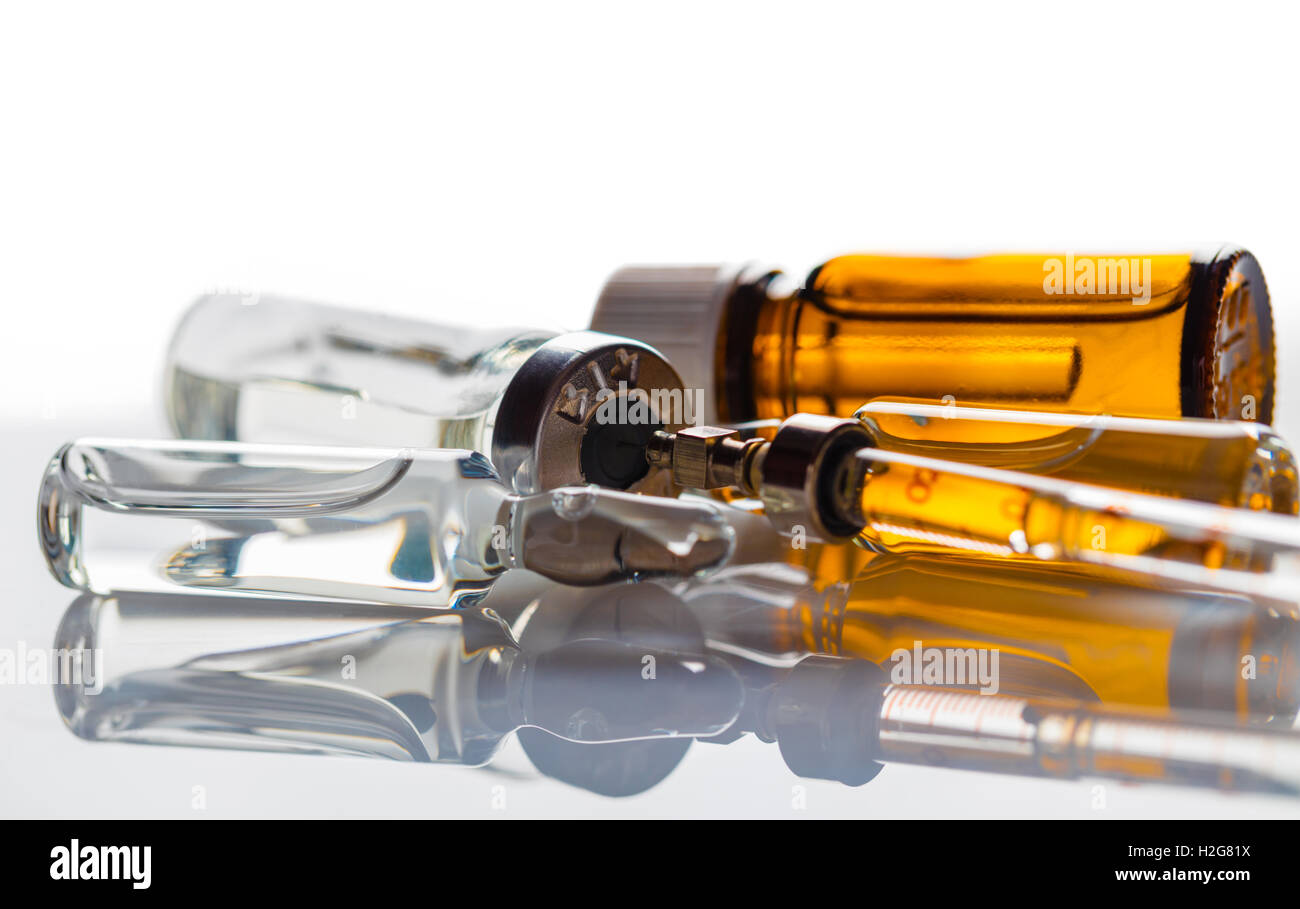 medicament in a glass vial and syringe closeup Stock Photo - Alamy