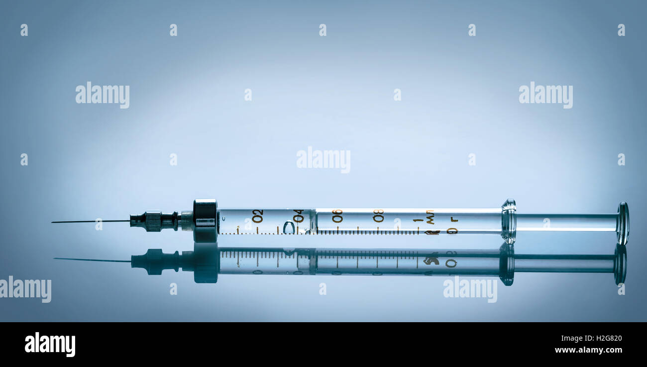 with the reflection of closeup a medical syringe Stock Photo - Alamy