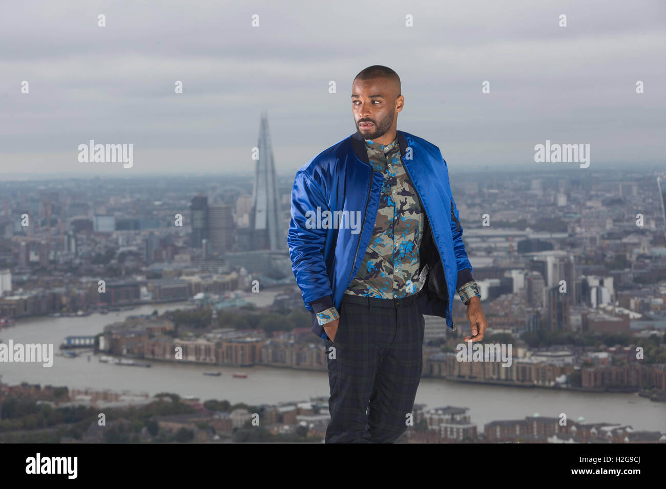 EDITORIAL USE ONLY Model Jason Dax poses on a catwalk on the rooftop of ...