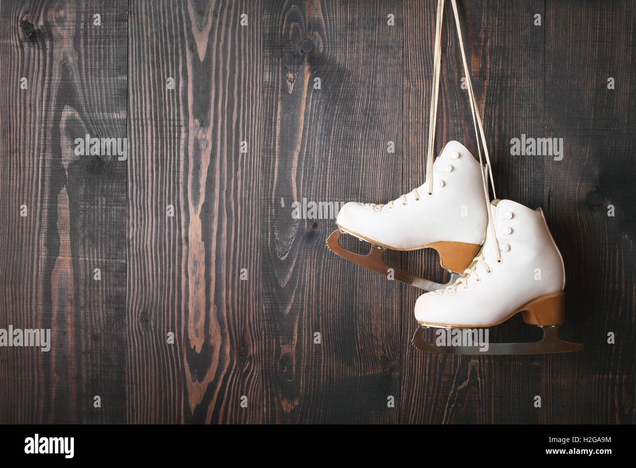 Girl with ice skates hi-res stock photography and images - Alamy