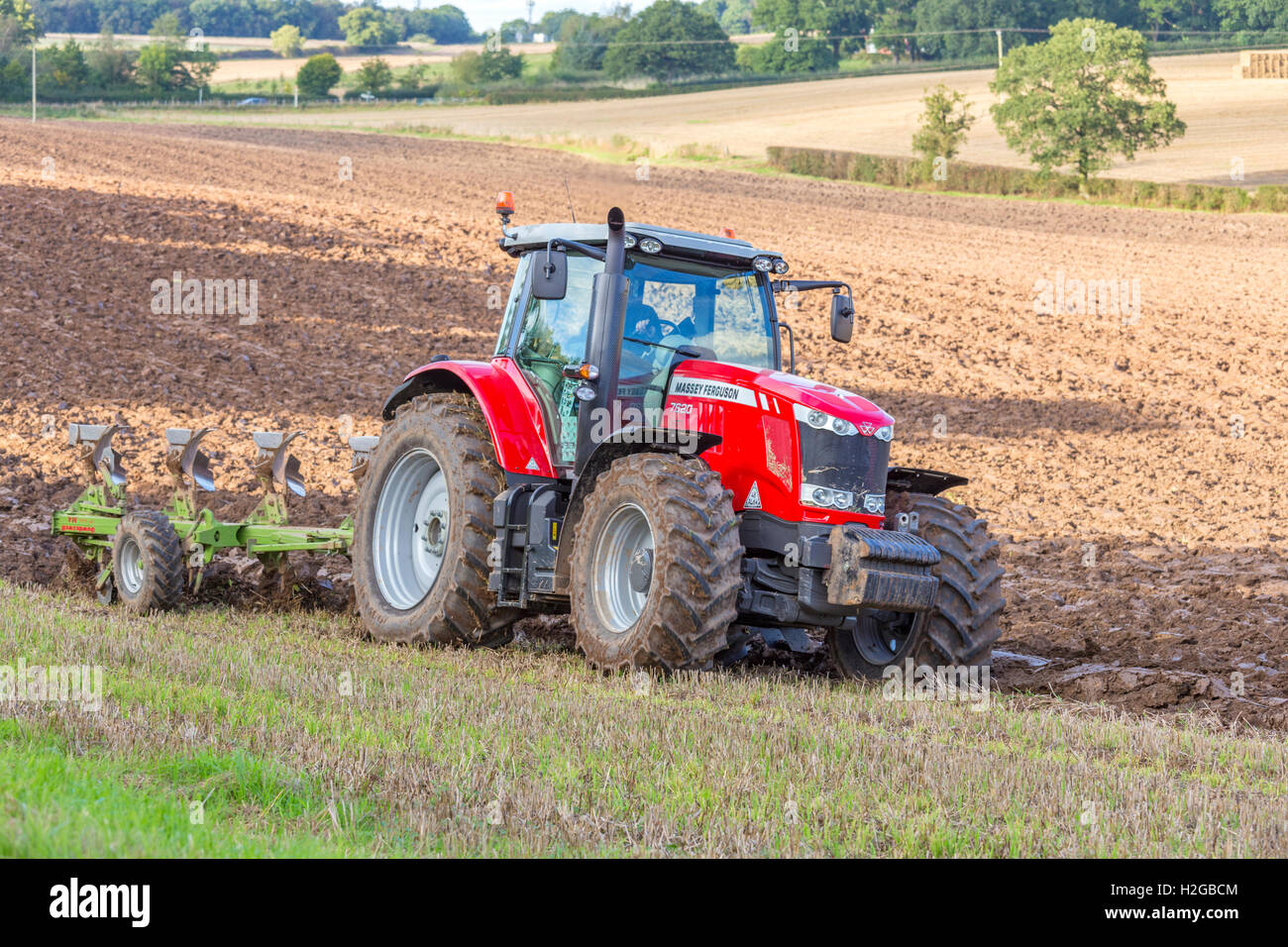 Farm Tractor Ploughing England Uk Stock Photos & Farm Tractor Ploughing ...