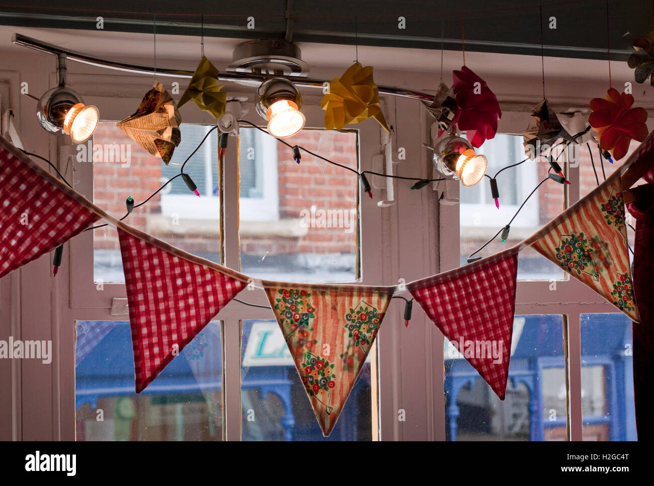 Sown cloth pennants in the window of a vintage shop Stock Photo - Alamy