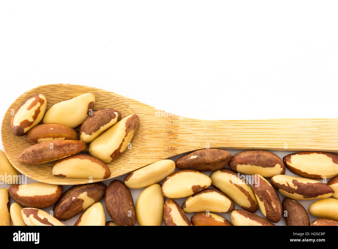 Top view of wooden spoon and selection of Brazil Nuts Stock Photo - Alamy