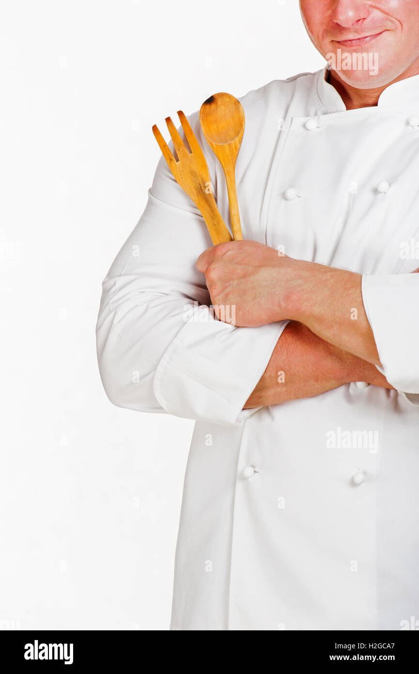 Chef man isolated over white background. Holding spoon and fork Stock ...