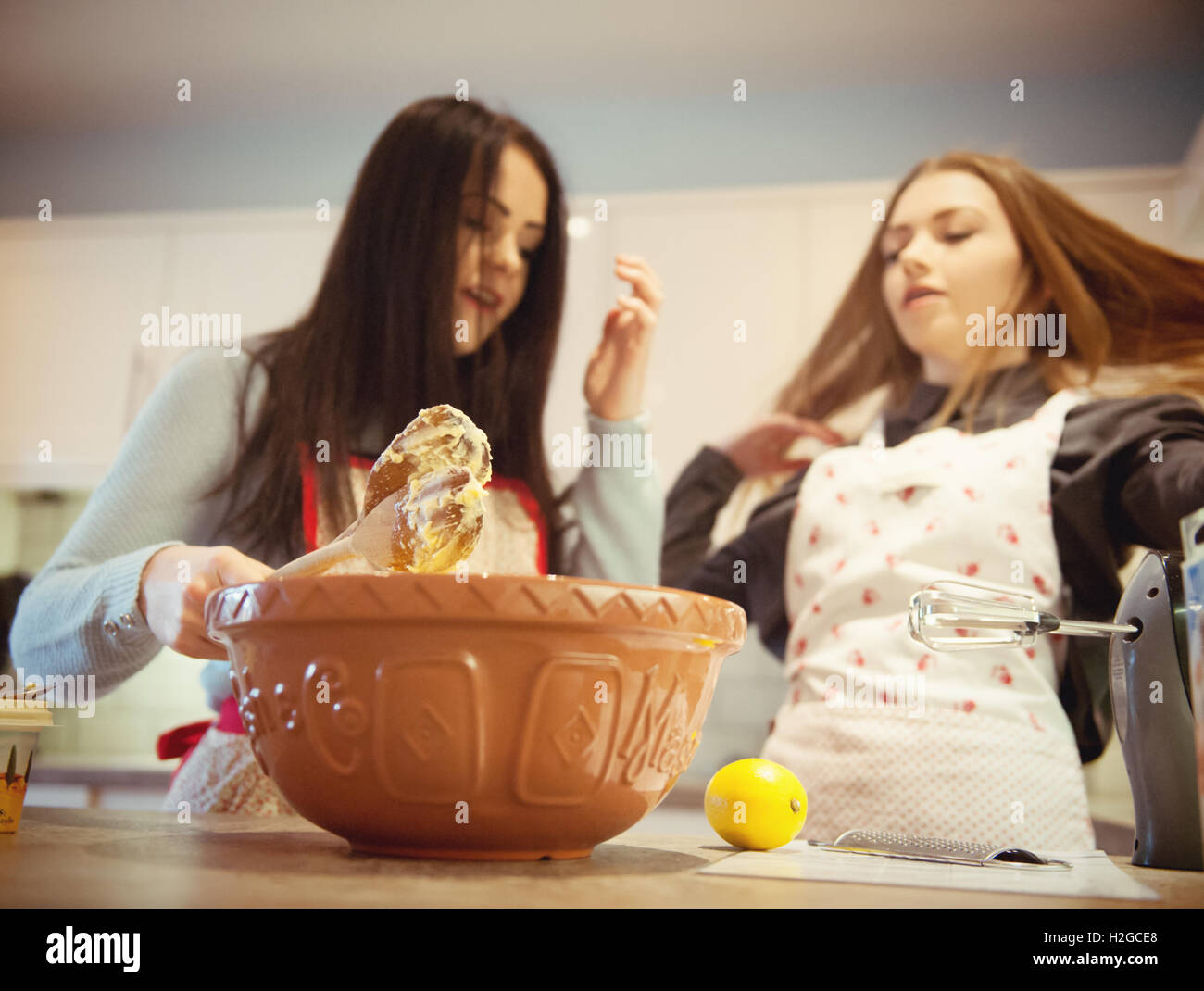 Teenagers cooking/baking in the Kitchen Stock Photo - Alamy