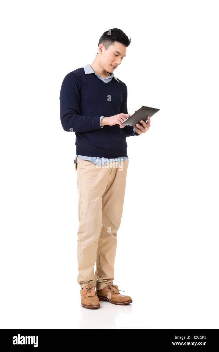 Asian man using pad Stock Photo - Alamy