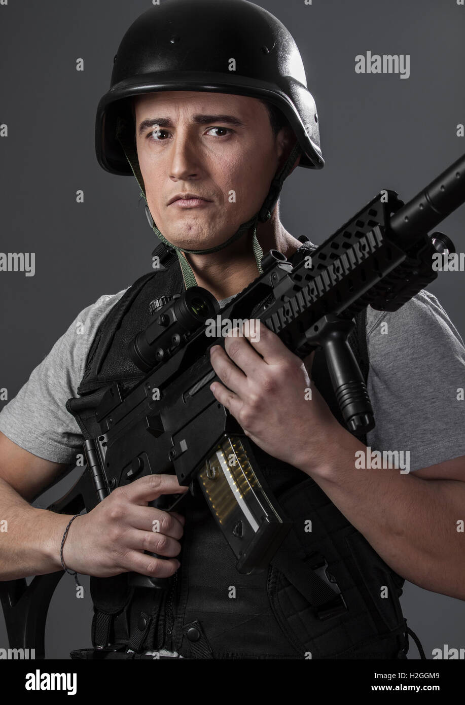 Fight, paintball sport player wearing protective helmet aiming p Stock ...