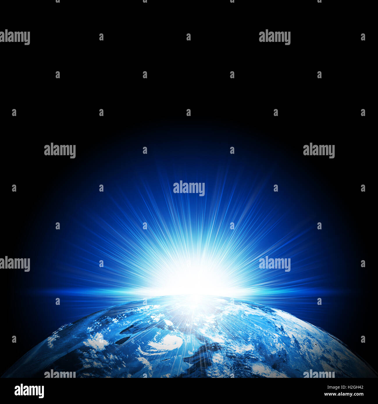 Earth planet in sun rays Stock Photo - Alamy