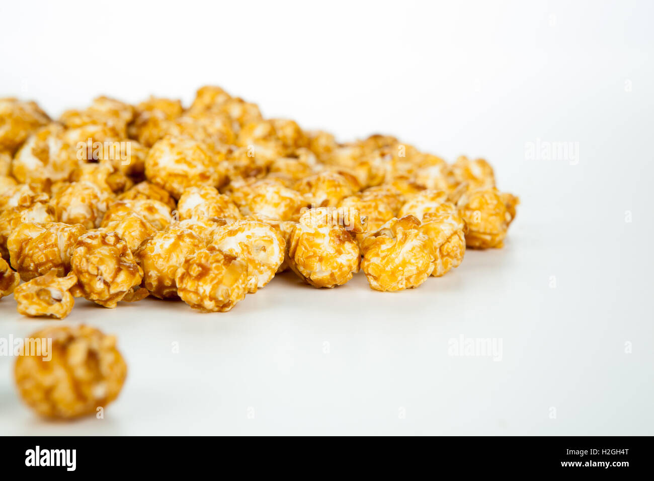 lots of popcorn balls with sugar Stock Photo - Alamy