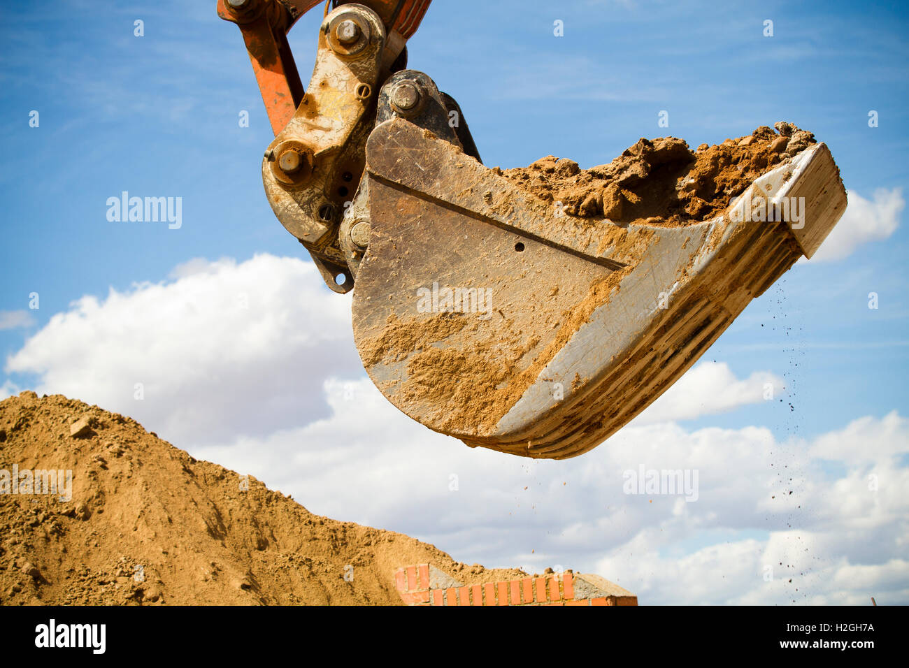Wheel loader machine unloading sand at eathmoving works in const Stock ...