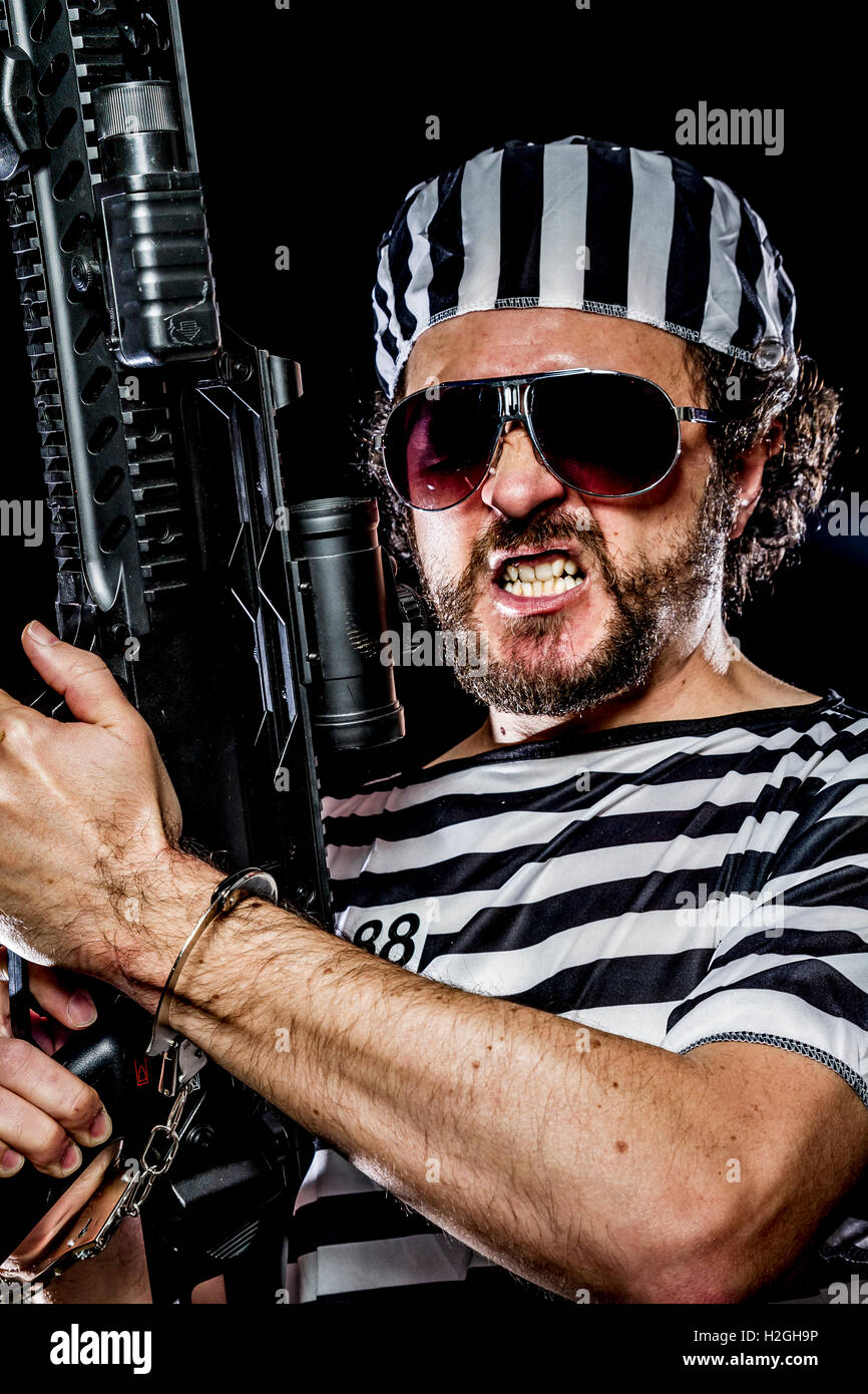 Power, Prison riot concept. Man holding a machine gun, prisoner Stock ...