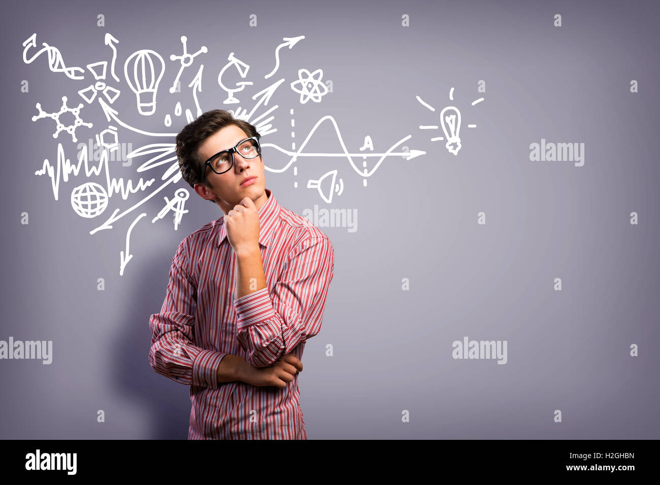 young man scientist with glasses thinking Stock Photo - Alamy