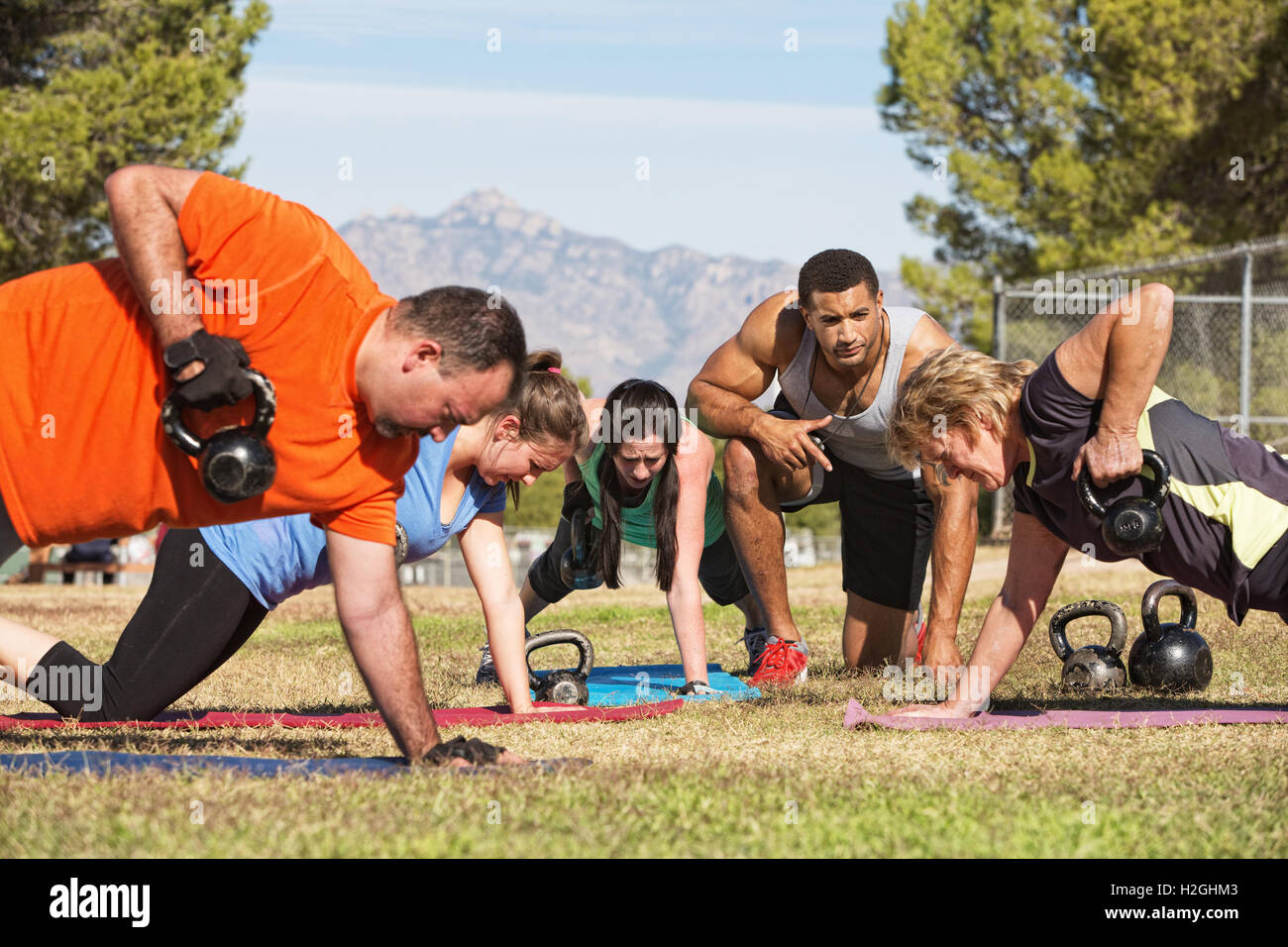 Exercise Group Using Kettle Bells Stock Photo - Alamy