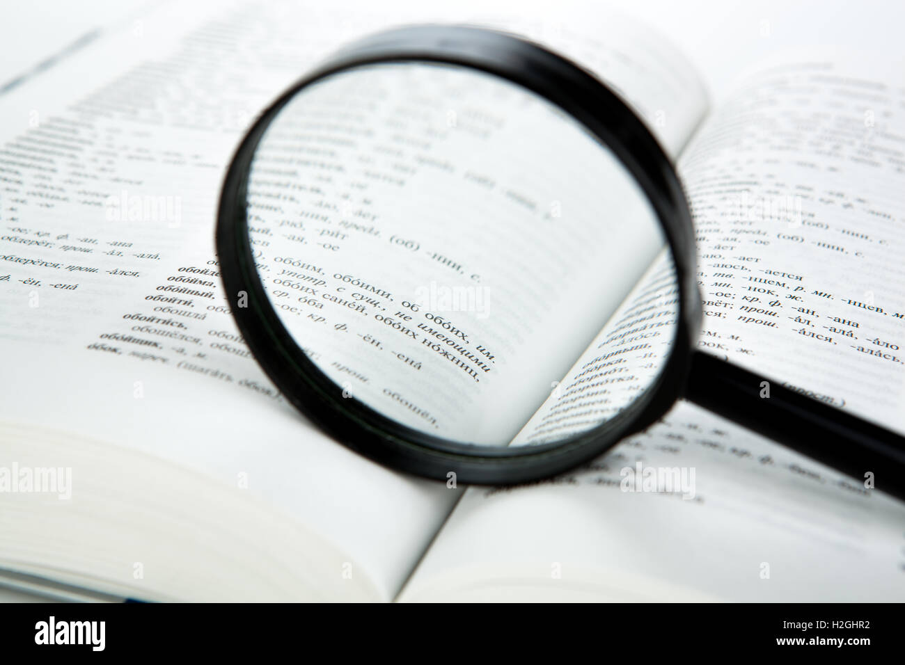 Open book magnifier hi-res stock photography and images - Alamy