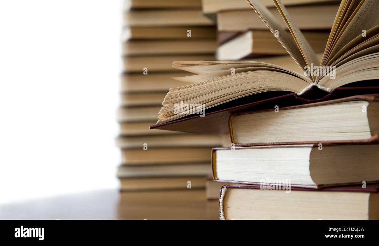 Old books on wood table hi-res stock photography and images - Alamy