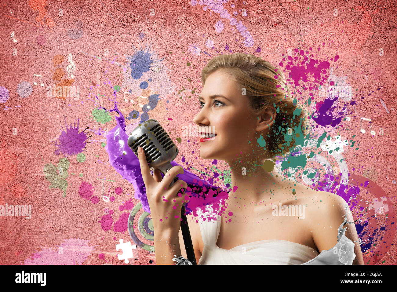 attractive female singer with microphone Stock Photo - Alamy