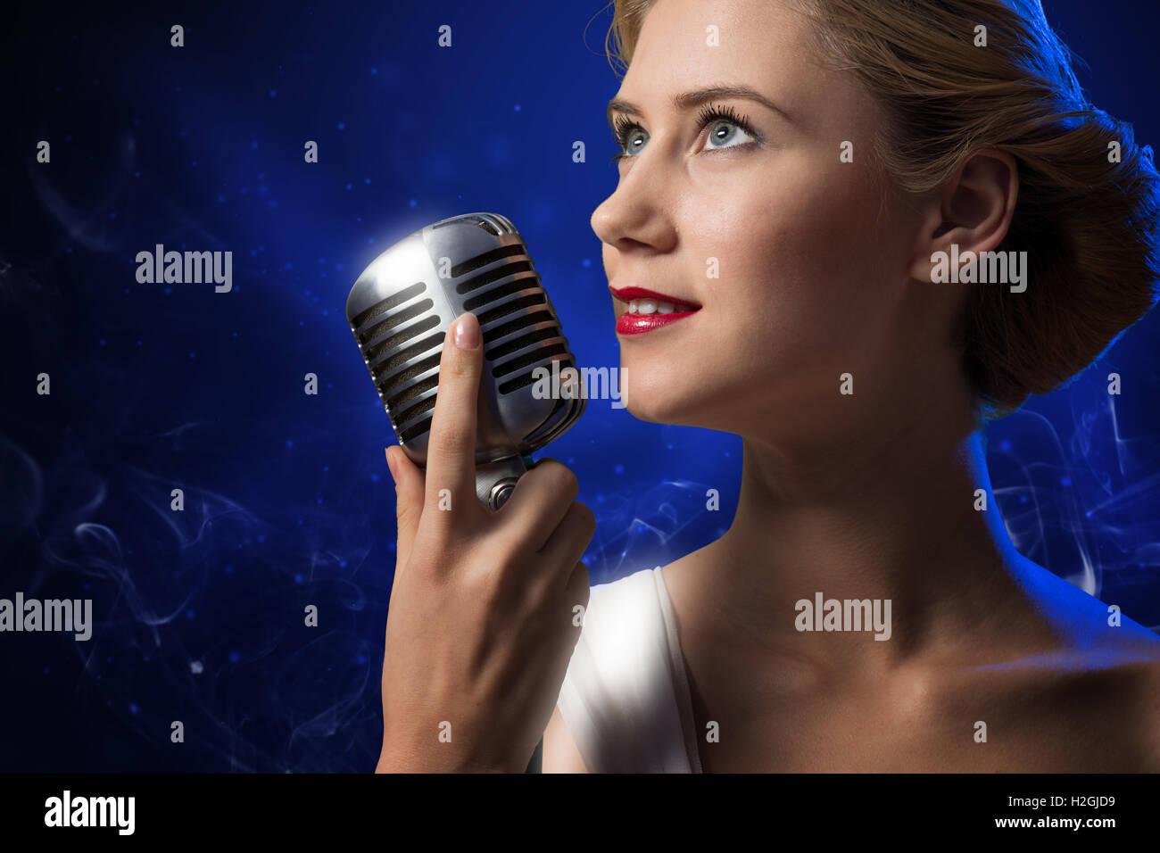 attractive female singer with microphone Stock Photo - Alamy