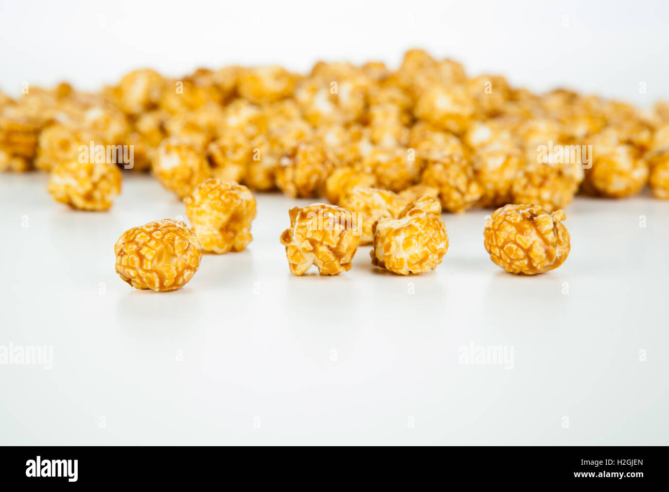 lots of popcorn balls with sugar Stock Photo - Alamy