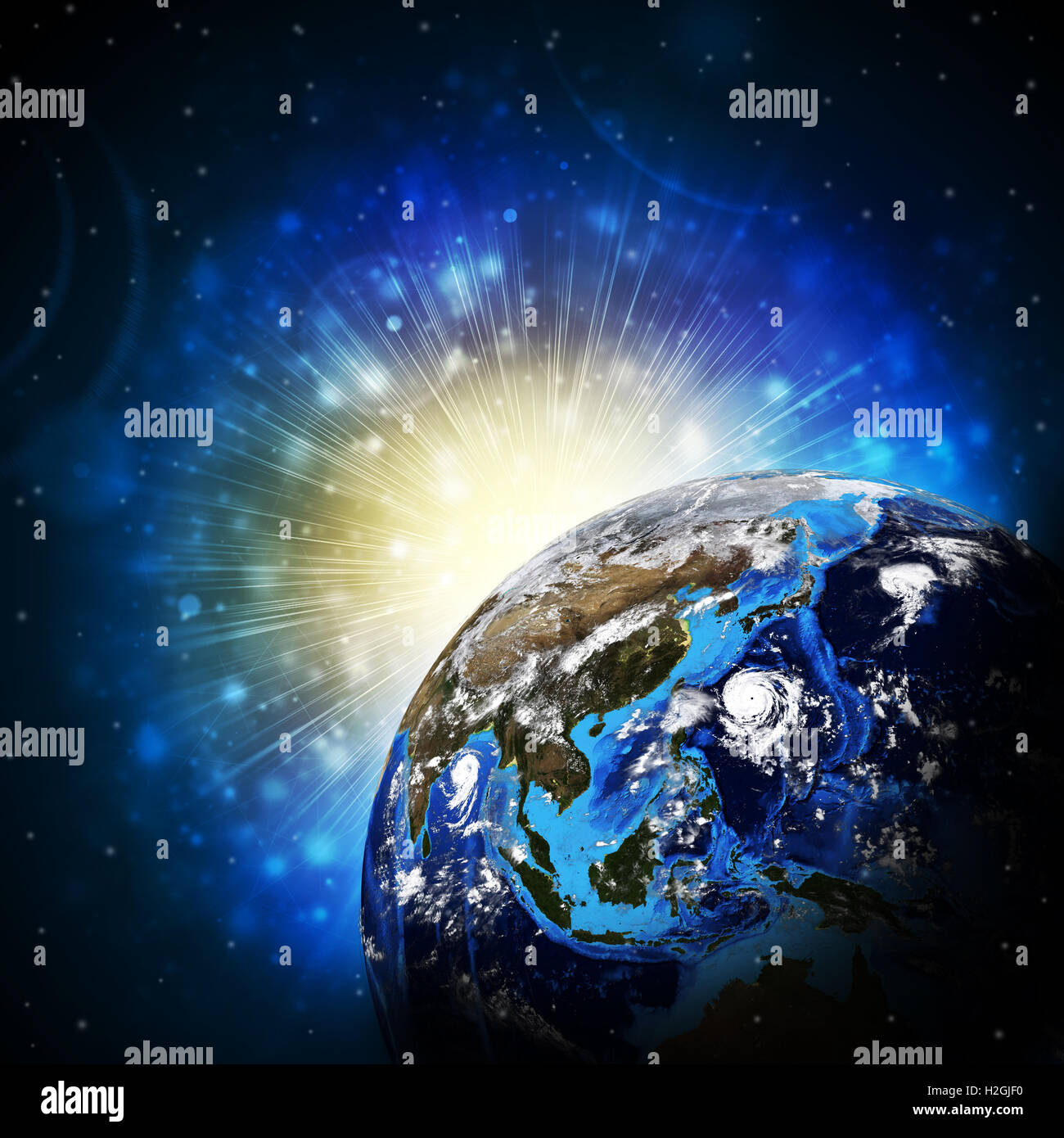 Earth planet in sun rays Stock Photo - Alamy