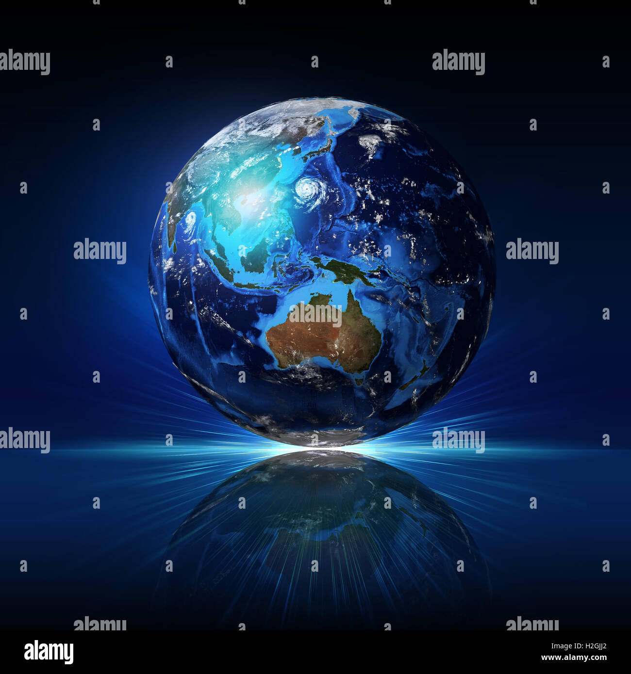 Earth planet on a reflective surface Stock Photo - Alamy