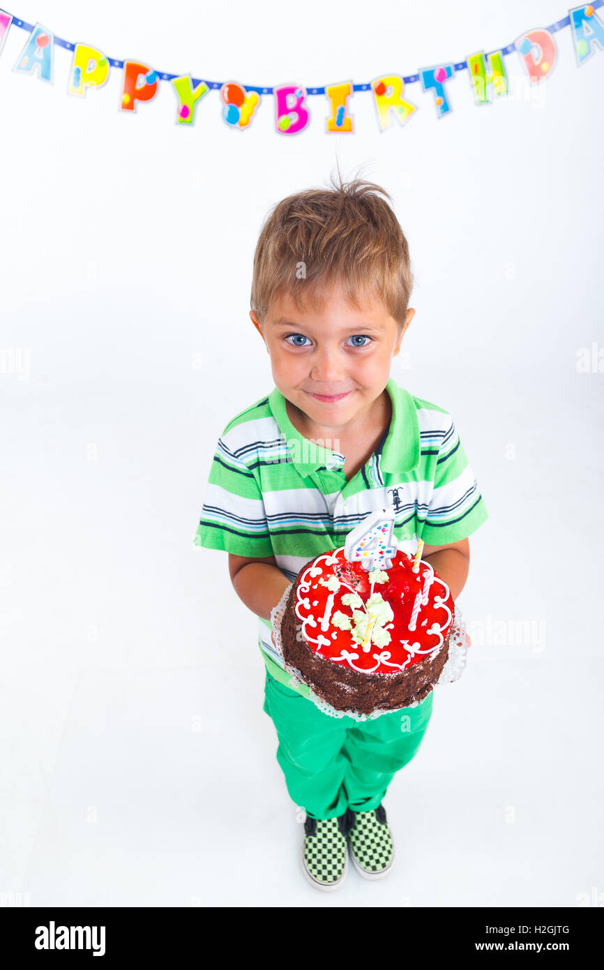 Boy with birthday cake Stock Photo - Alamy