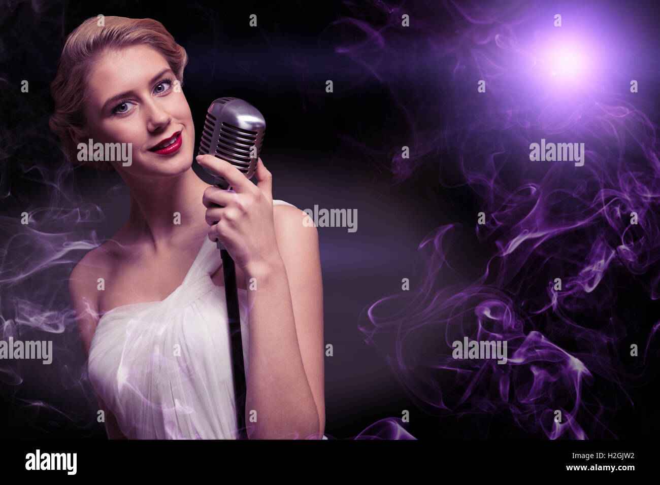 attractive female singer with microphone Stock Photo - Alamy