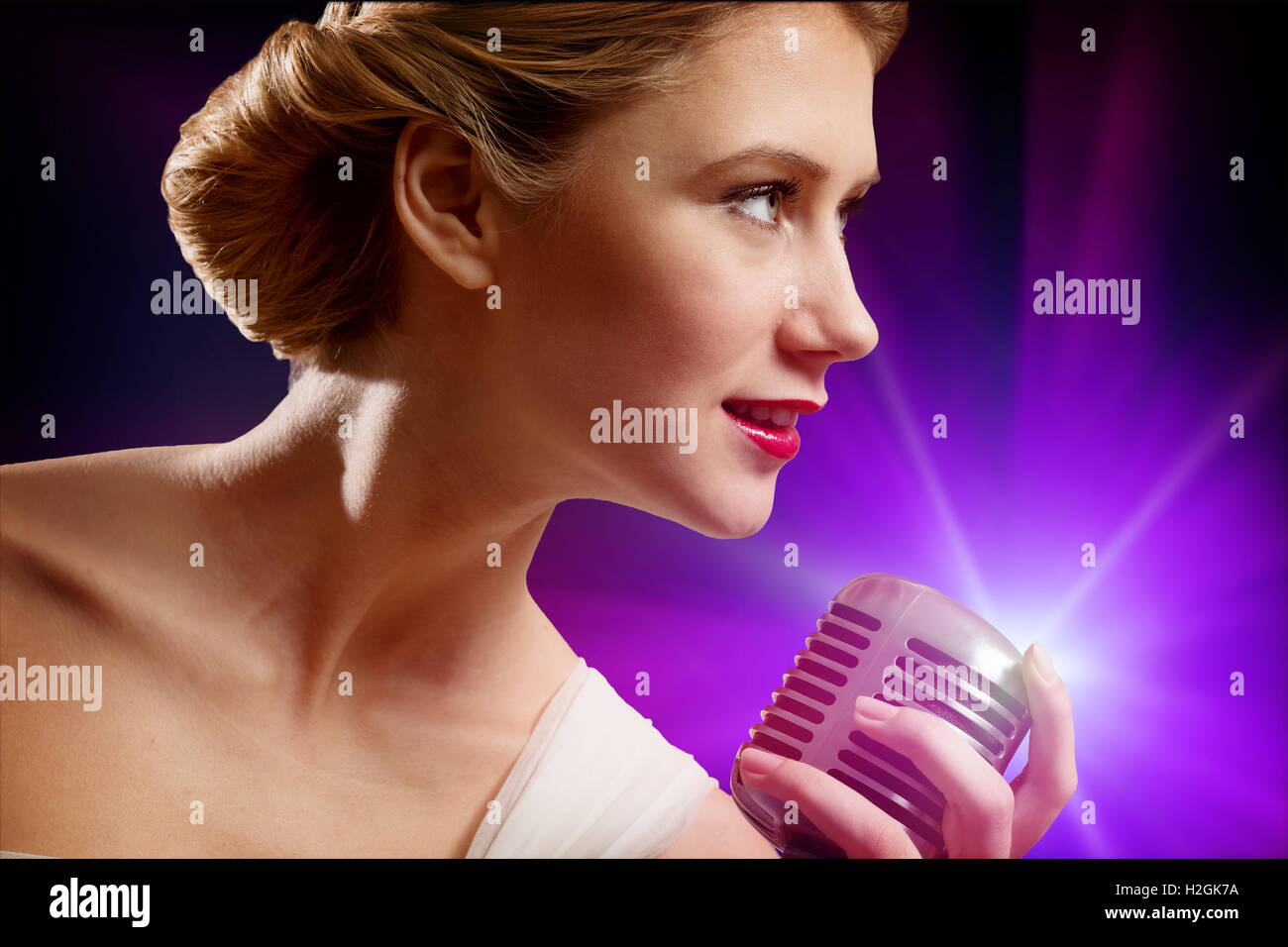 attractive female singer with microphone Stock Photo - Alamy