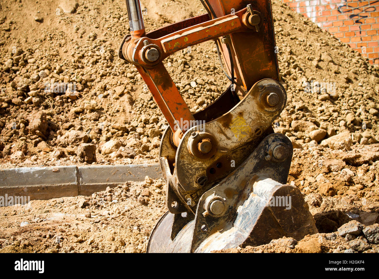 Excavator digging a deep trench, working Stock Photo - Alamy