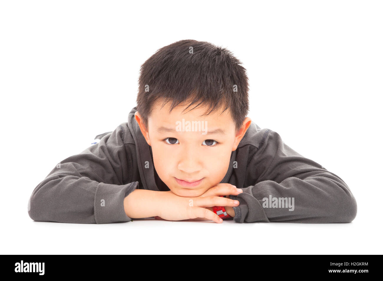 smiling boy is lying on the floor Stock Photo - Alamy
