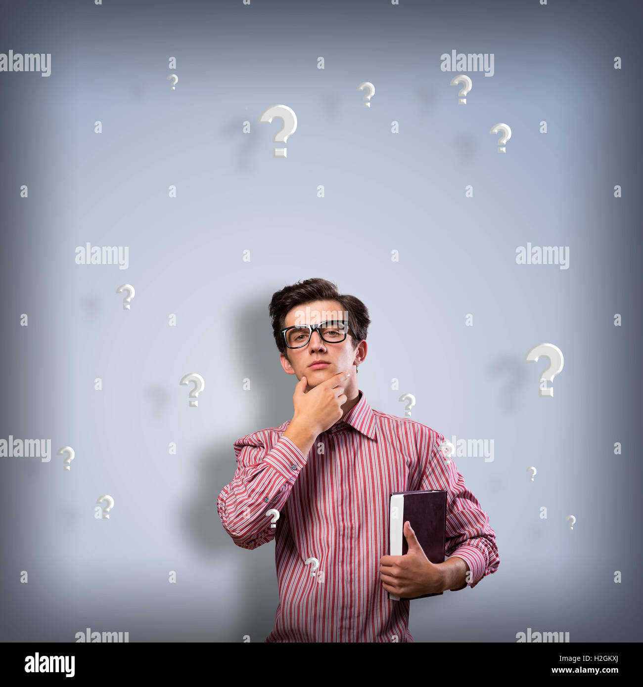 young man scientist with glasses thinking Stock Photo - Alamy