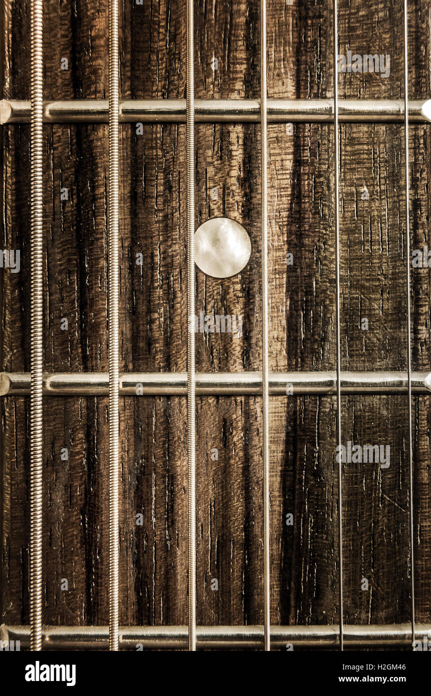 Detail close-up view of guitar strings and frets Stock Photo - Alamy
