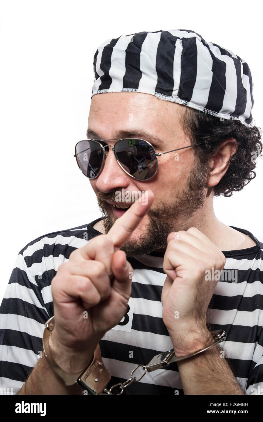 Funny man prisoner criminal with chain ball and handcuffs in stu Stock ...