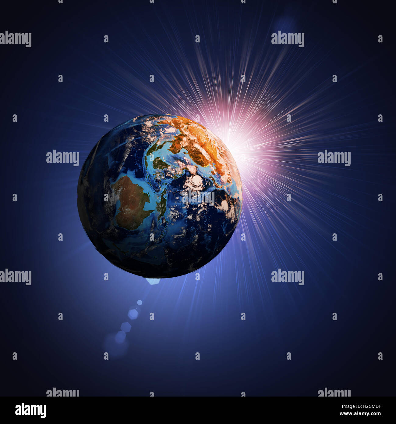Earth planet in sun rays Stock Photo - Alamy