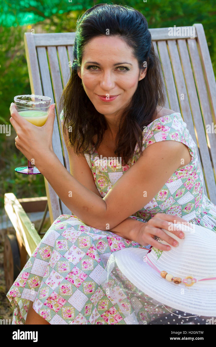 Woman gardening. Mature girl gardening in her backyard. spring s Stock ...