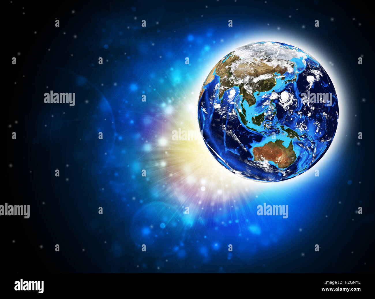 Earth planet in sun rays Stock Photo - Alamy